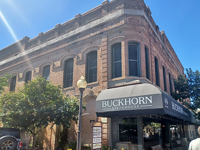 The historic brick fa&ccedil;ade of Buckhorn Steakhouse glows golden at sunset, a beacon of carnivorous delights in downtown Winters that's impossible to resist.