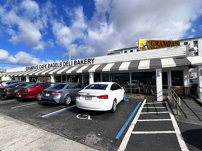 The promised land of carbs beckons with its classic striped awning. Grampa's exterior might be humble, but those full parking spaces tell the real story.