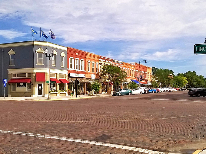 Downtown Lindsborg greets visitors with classic brick buildings, Swedish flags, and that small-town charm that makes you want to cancel your return flight.