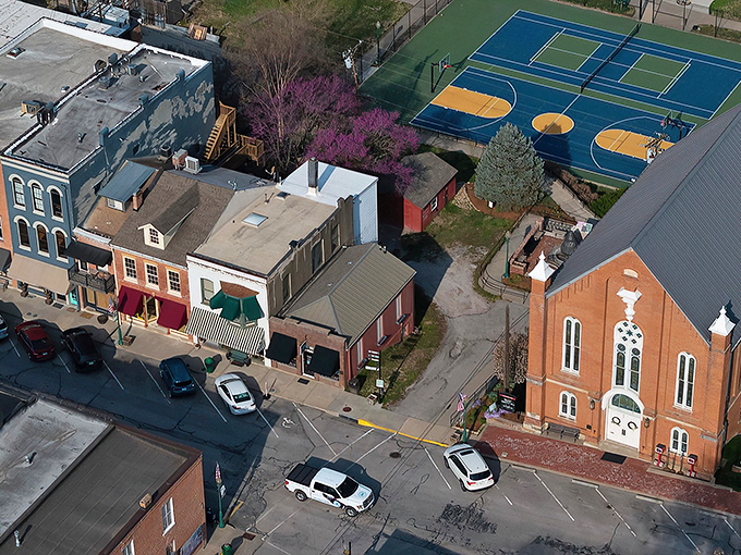 Main Street magic in full display. Weston's historic thoroughfare slopes gently upward, brick buildings standing sentinel to a simpler time that somehow still exists.