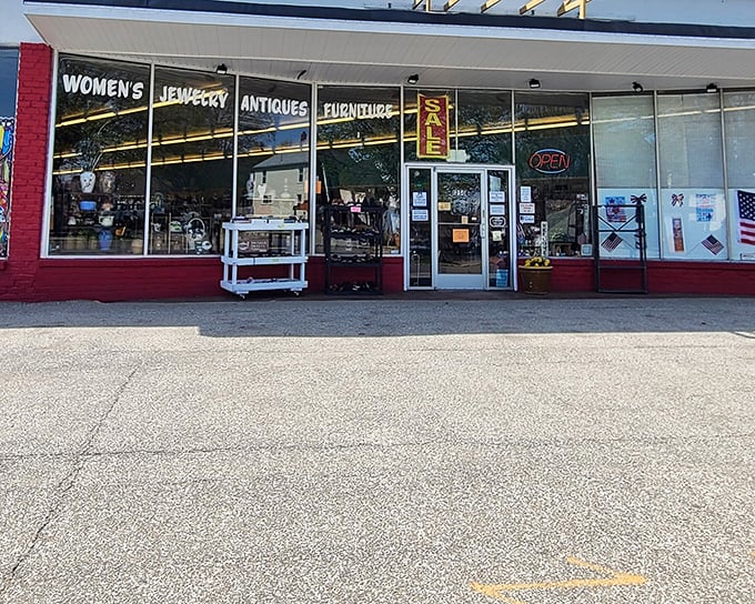 The red-brick storefront with its "WOMEN'S JEWELRY ANTIQUES FURNITURE" signage promises treasures within &ndash; Erie's own cabinet of curiosities awaits!