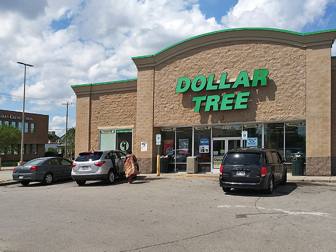 The emerald beacon of bargain paradise beckons from Greenfield Avenue, where the Dollar Tree sign promises retail therapy without the financial hangover.