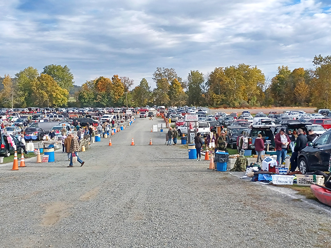 Treasure hunters navigate the covered pavilions at Jake's, where wooden tables await vendors and their wares like blank canvases ready for weekend masterpieces.
