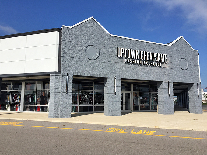 The sleek blue-gray exterior of Uptown Cheapskate stands like a fashion oasis in Hilliard, promising treasure hunters a bounty of brand-name bargains inside.