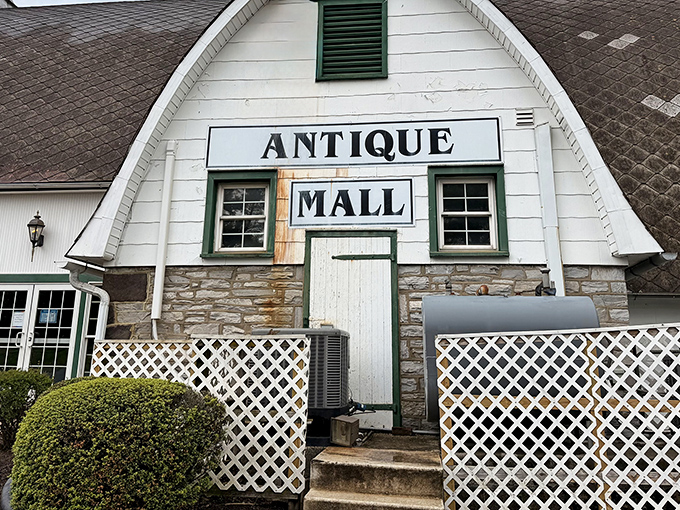 The iconic barn-shaped exterior of Crossroads Antique Mall stands like a beacon for treasure hunters in Hershey, promising adventures in time travel without the flux capacitor.