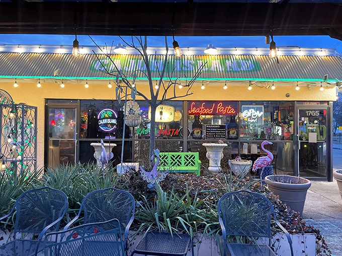 The neon "Seafood Pasta" sign glows like a culinary lighthouse, beckoning hungry travelers to this unassuming strip mall treasure in Reynoldsburg.