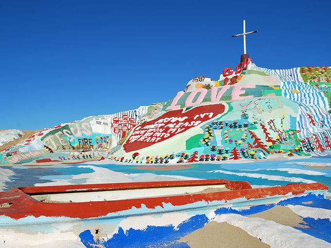 The desert's most colorful surprise awaits! Salvation Mountain rises from the barren landscape like a rainbow-frosted cake that forgot to stop at one layer.