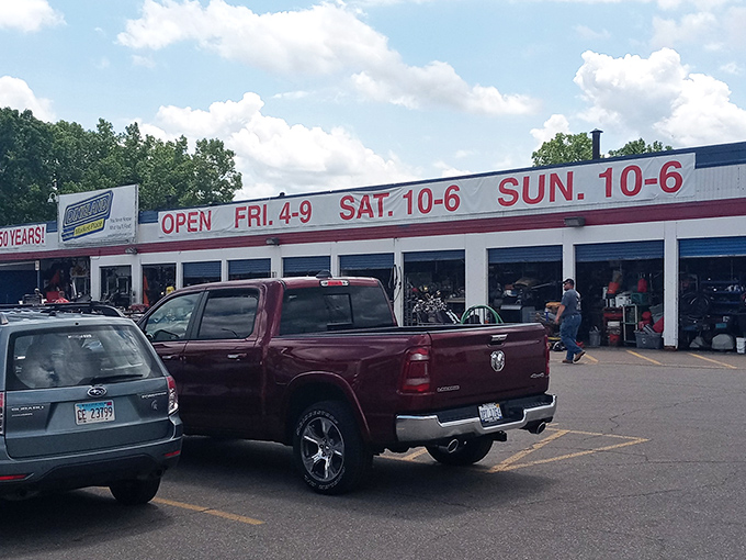 The weathered facade of Dixieland proudly announces "OPEN FOR OVER 50 YEARS!" like a badge of honor in a world of here-today-gone-tomorrow retail.