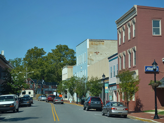 The green footbridge stretching across calm waters perfectly captures Milford's serene charm &ndash; where nature and small-town engineering create postcard-worthy moments. 