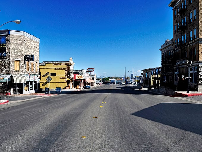 Main Street Tonopah greets visitors with historic brick buildings while fog dramatically embraces the mountain, like nature's own theater curtain rising on a mining town stage.
