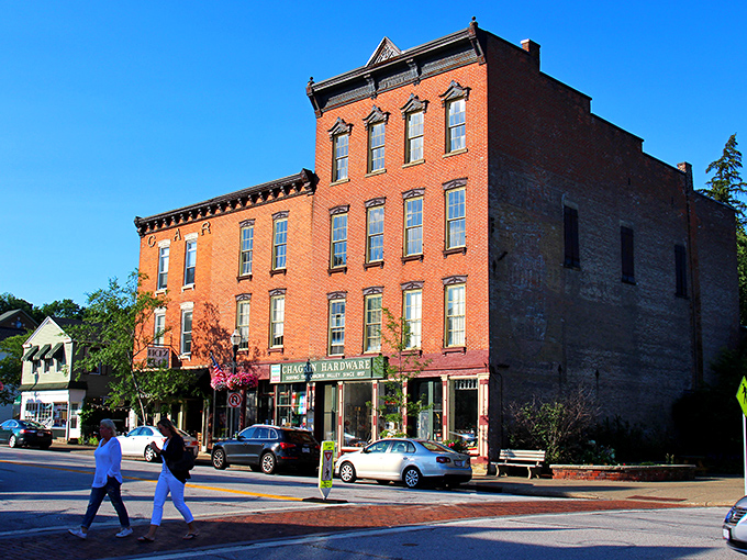 Brick facades and colorful awnings line Main Street, where small-town charm meets architectural character in a scene straight from a Hallmark movie.