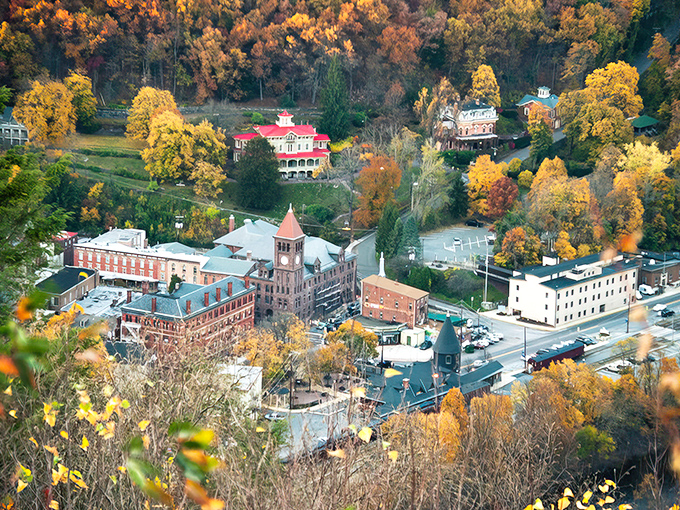 A bird's-eye view of Jim Thorpe nestled in autumn splendor. The Victorian buildings look like they're playing hide-and-seek with the mountains.