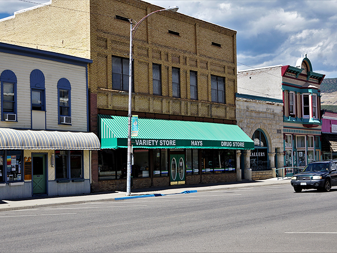 Downtown Paonia sits like a movie set against the dramatic backdrop of mountains, where storm clouds gather but never dampen the town's charm.
