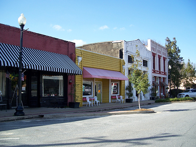 Main Street magic! These colorful storefronts aren't just buildings&mdash;they're time machines disguised as architecture, complete with charming awnings and small-town personality.