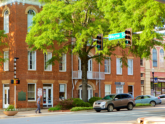 Downtown Milledgeville's historic brick buildings stand like sentinels of Southern charm, where modern businesses thrive within walls that have witnessed centuries of Georgia history.