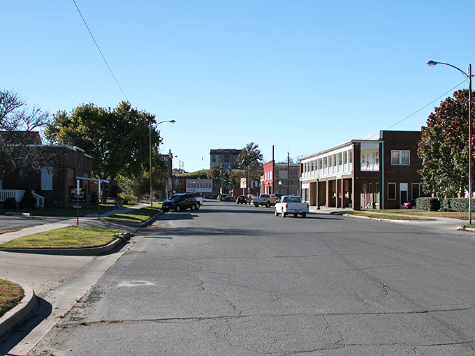 Historic brick buildings line Pawhuska's main street, telling stories of boom times and quiet years while standing proudly against the Oklahoma sky.