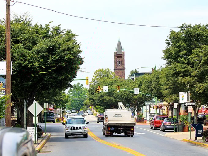 Palermo's Pizza stands as a colorful sentinel on Hummelstown's Main Street, where red umbrellas beckon like culinary lighthouses guiding hungry travelers home.