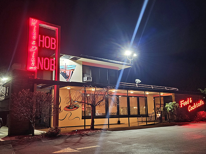 The iconic red HOBNOB sign stands tall against the Wisconsin sky, a beacon for prime rib pilgrims and supper club aficionados for generations.