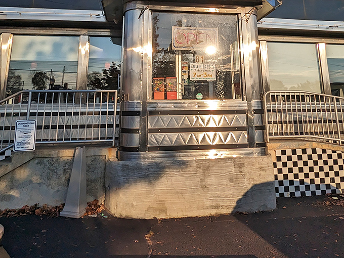 The classic stainless steel exterior with its vintage "OPEN" sign isn't just inviting&mdash;it's practically a time portal to simpler days.