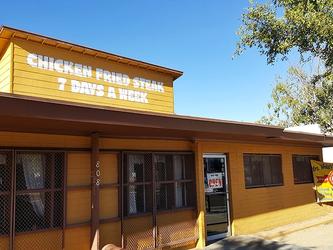 That cheerful yellow exterior and vibrant mural practically shout "comfort food paradise" from across the street.