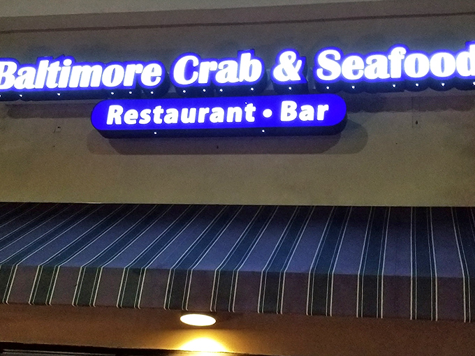 The blue neon sign beckons like a lighthouse for seafood lovers. Maryland magic awaits inside this Atlanta treasure.