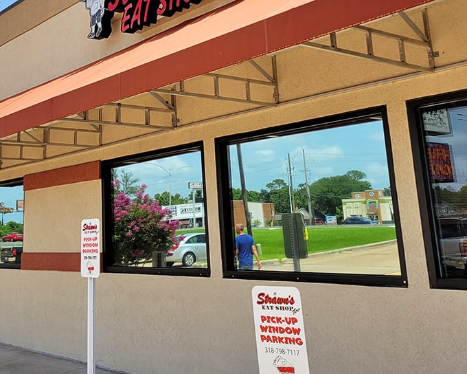The unassuming red awning of Strawn's Eat Shop Too stands like a beacon to hungry travelers. No fancy frills needed when the food inside speaks volumes.