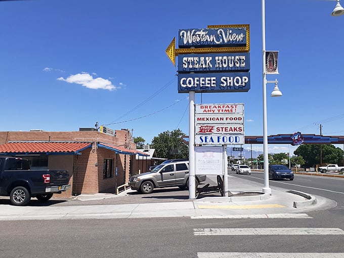The neon-adorned vintage sign stands like a sentinel of comfort food, promising steaks, seafood, and the timeless appeal of a genuine coffee shop experience.