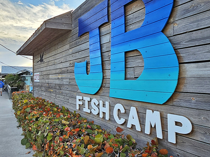 The weathered wooden exterior and bold blue sign announce you've arrived at seafood paradise. Florida authenticity doesn't get more real than this.