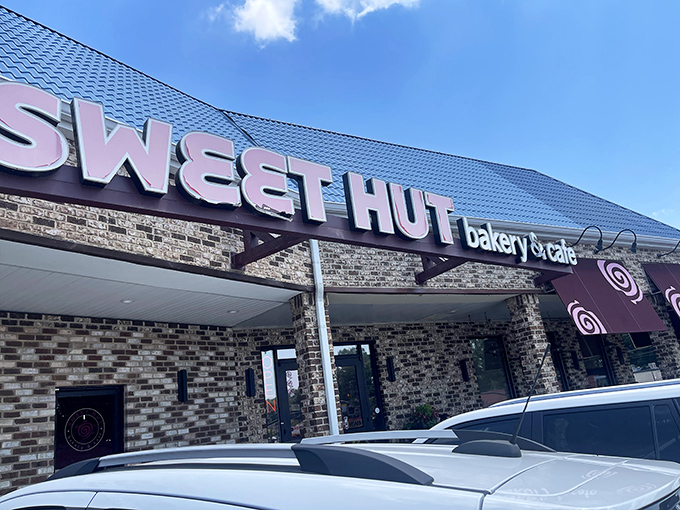The distinctive blue roof and stone facade of Sweet Hut beckons like a beacon of baked goodness in Doraville's culinary landscape.