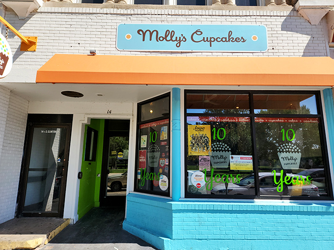 The blue and orange storefront of Molly's Cupcakes stands out on Iowa City's Washington Street like a dessert oasis in a sea of brick buildings.