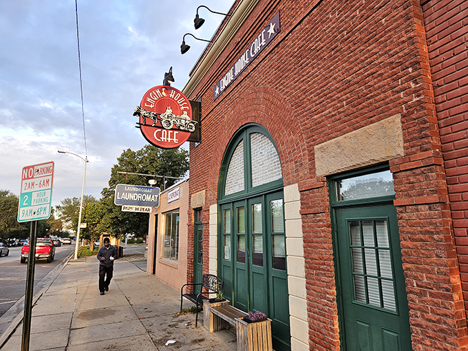 The iconic brick facade of Engine House Cafe stands as a delicious monument to adaptive reuse. Those green doors once welcomed fire trucks; now they usher in hungry Nebraskans.