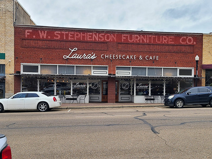 The iconic red brick fa&ccedil;ade of Laura's Cheesecake & Caf&eacute; stands as a beacon of culinary comfort on Mount Pleasant's town square, promising sweet salvation within.