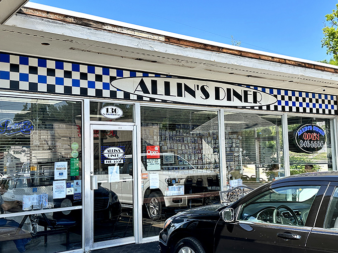 The classic black-and-white checkered awning of Allin's Diner isn't just decoration&mdash;it's a beacon calling hungry souls to pancake paradise.
