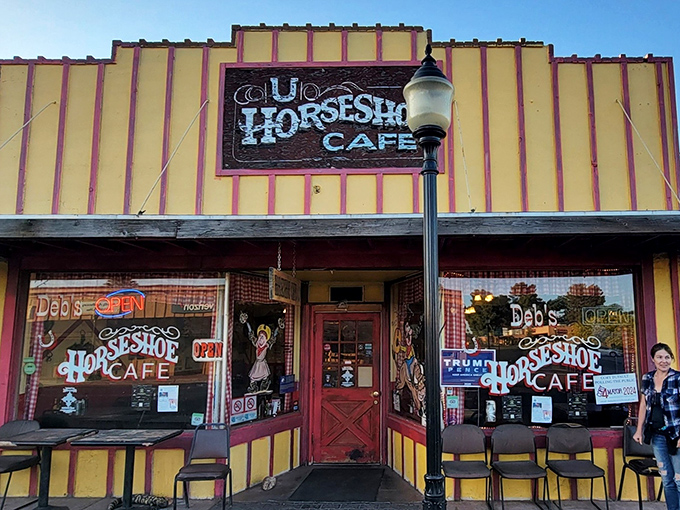 The yellow and red facade of Horseshoe Cafe stands like a beacon of breakfast hope on Wickenburg's main street, promising culinary comfort within those Western-themed walls.