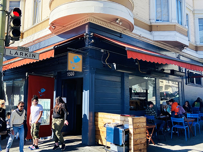 The red awning and line stretching down the block tells you everything &ndash; this isn't just breakfast, it's an event worth waiting for.