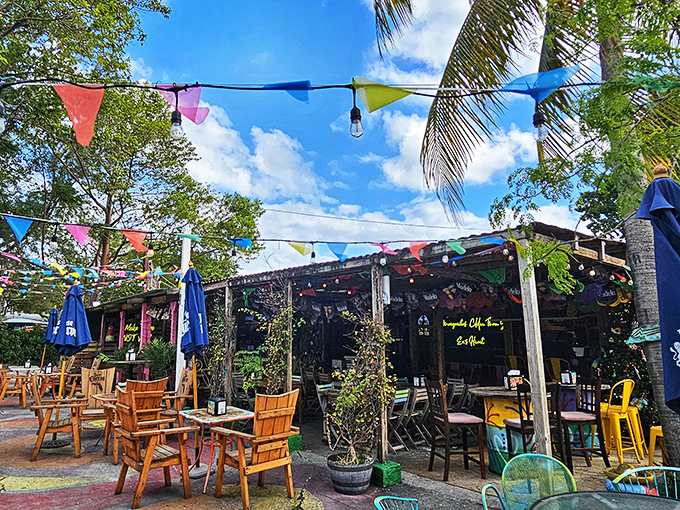 Welcome to paradise! La Mexicana's charming outdoor entrance, with its colorful umbrellas and lush greenery, promises a tropical escape from everyday life.