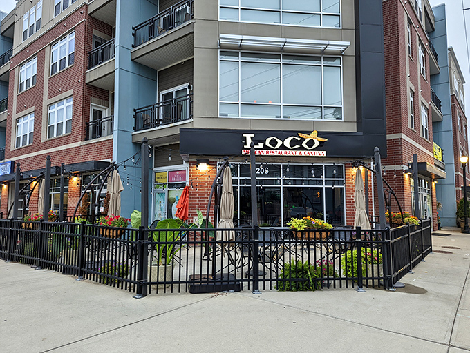 Those vibrant orange umbrellas on the patio aren't just for show—they're beacons calling you to Fall Creek Place's most flavorful corner.