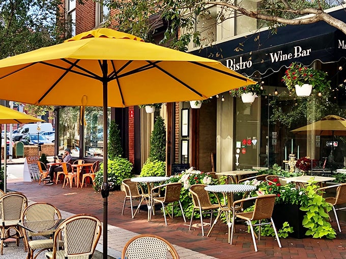 Yellow umbrellas dance like beacons of French joie de vivre, inviting you to slow down and channel your inner Parisian on this charming Baltimore patio.