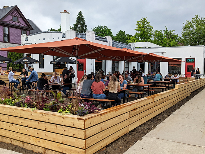 Twilight transforms this former service station into a magical oasis, where string lights and happy diners create the perfect Michigan summer evening vibe.