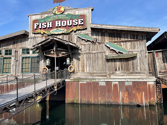 The rustic wooden exterior of White River Fish House beckons like an old friend, promising authentic Ozark flavors within its weathered walls.
