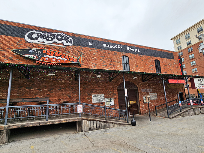 The brick facade and vintage neon sign of Pearl's Crabtown stand as a beacon for seafood lovers in landlocked Oklahoma City. Maritime dreams in Bricktown!