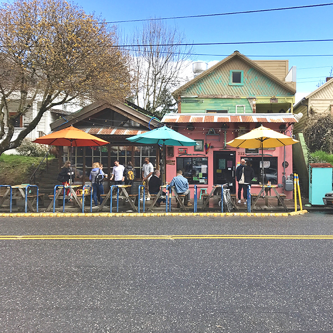 The pink facade of ¿Por Qué No? beckons like a tropical oasis in Portland, complete with string lights and a crowd that knows where the good stuff is.