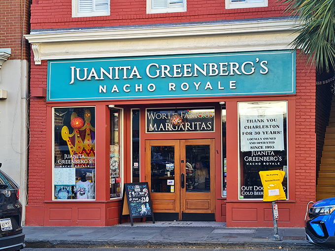 The brick-red facade of Juanita Greenberg's stands like a delicious mirage on Charleston's historic streets, promising margarita magic and nacho nirvana within.