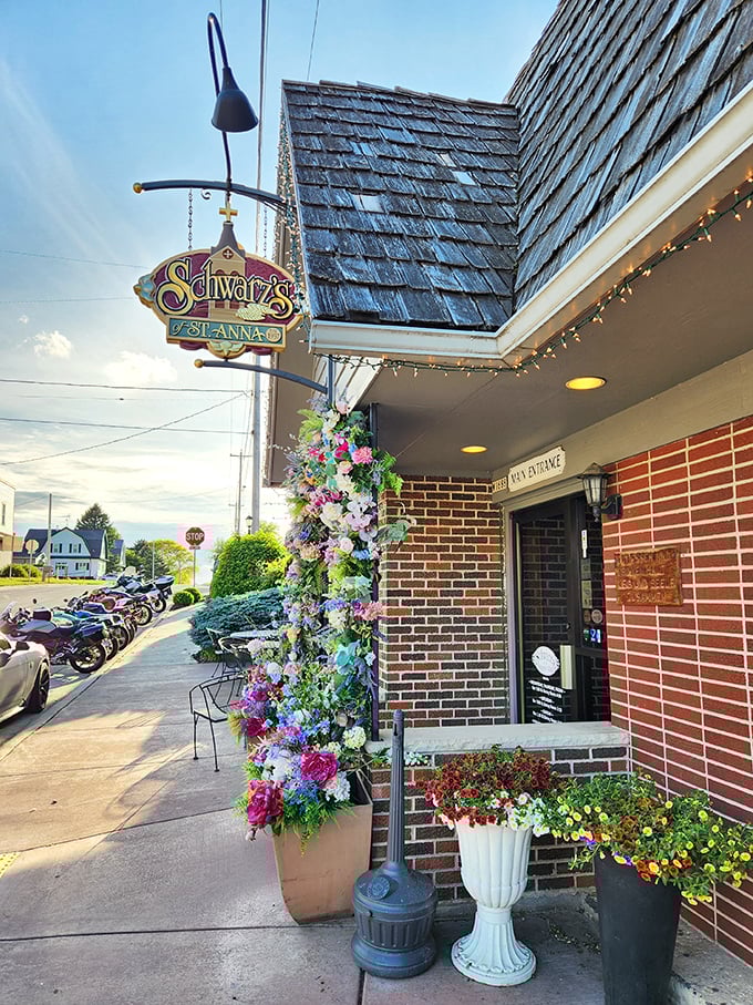 The iconic shingled roof and brick exterior of Schwarz's stands as a beacon of culinary tradition in New Holstein, welcoming hungry pilgrims at dusk.
