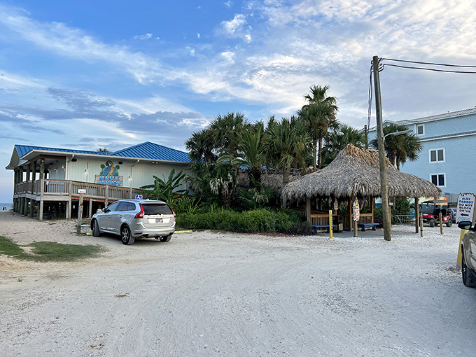 The Blue Parrot's beachfront charm beckons with its bright blue roof and thatched tiki hut&mdash;Florida architecture that practically whispers "your office emails can wait."