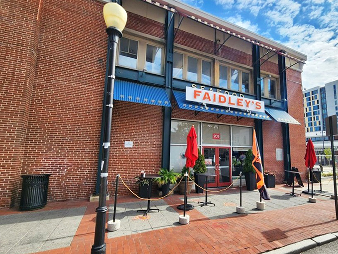 The brick facade and iconic blue awning of Faidley's stands like a seafood beacon in Baltimore, promising treasures of the Chesapeake within.