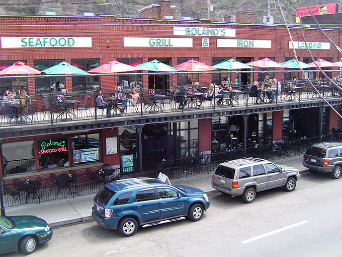The iconic brick fa&ccedil;ade of Roland's stands proudly in Pittsburgh's Strip District, its neon-green signage promising oceanic delights in the heart of steel country.