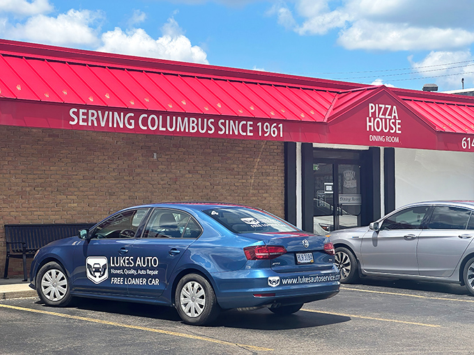 The iconic red roof of The Pizza House stands as Columbus's culinary lighthouse, beckoning hungry patrons for generations with its no-nonsense charm.