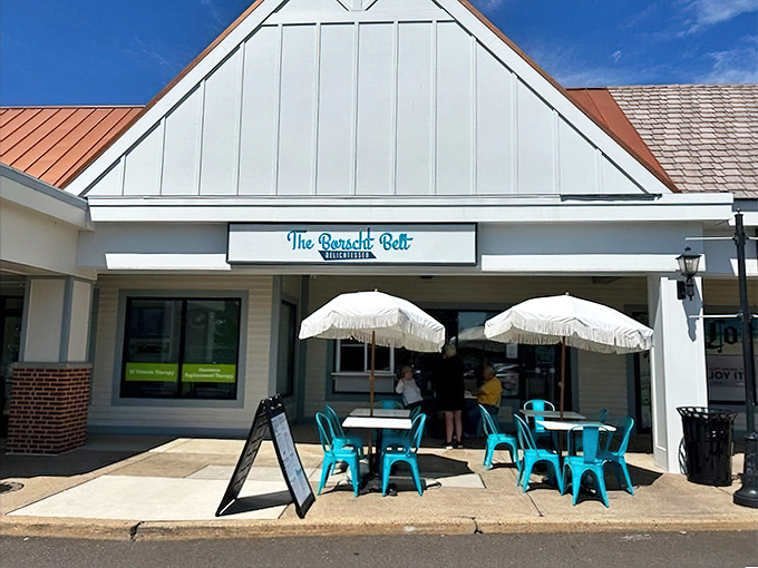 The promise of culinary nirvana hides behind this unassuming storefront, where those turquoise chairs beckon like old friends ready for a good schmooze.