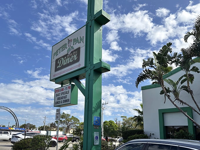 The iconic green and white sign welcomes hungry travelers like a beacon of breakfast hope. Palm trees and promise await.